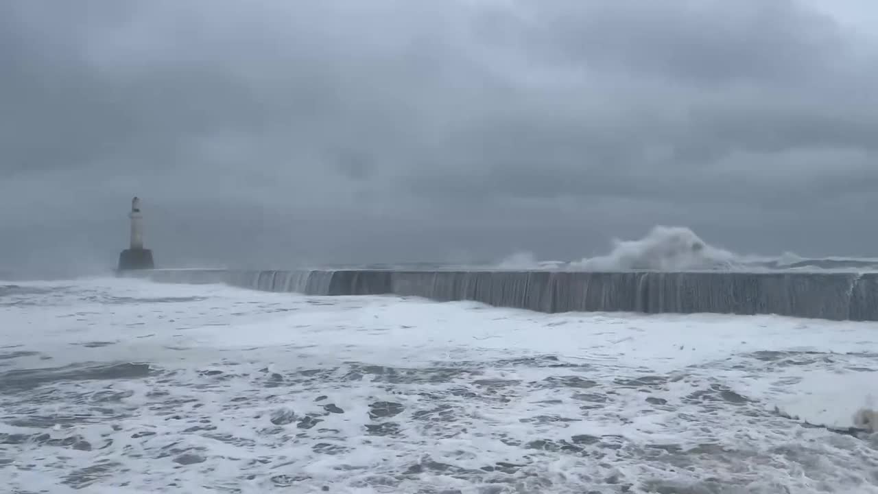 Coast battered by strong waves during stormy weather in Scotland