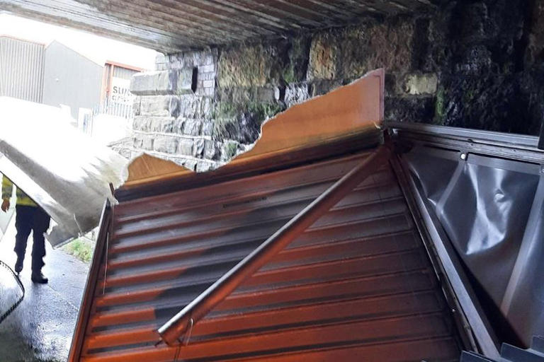 Pictures show damage after lorry crashes into bridge