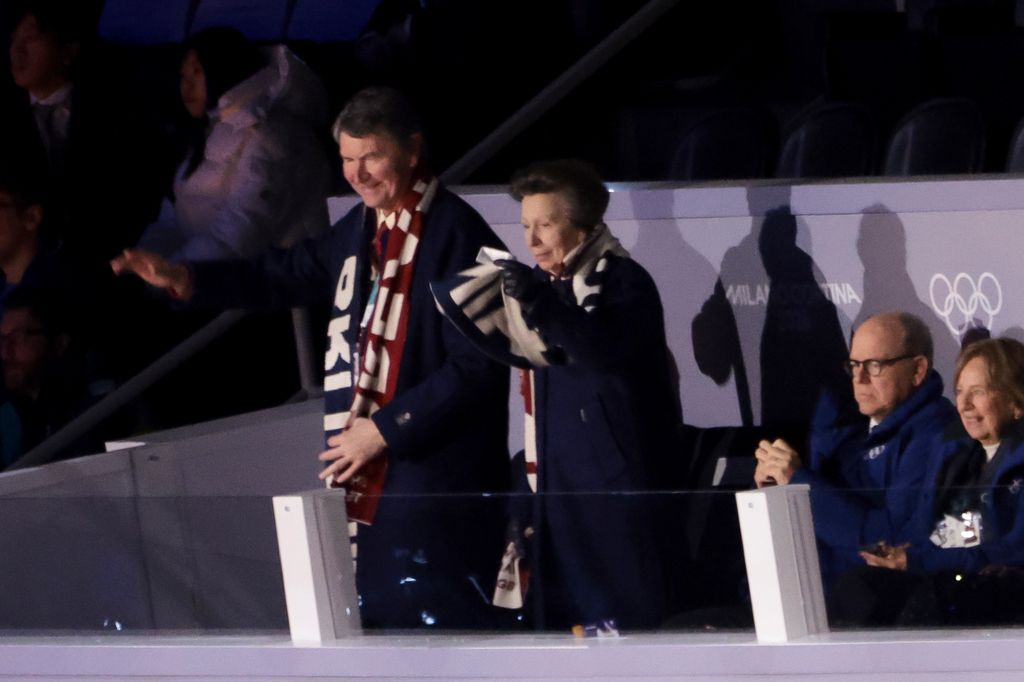 Princess Anne and husband Sir Timothy Laurence beam in matching scarves ...