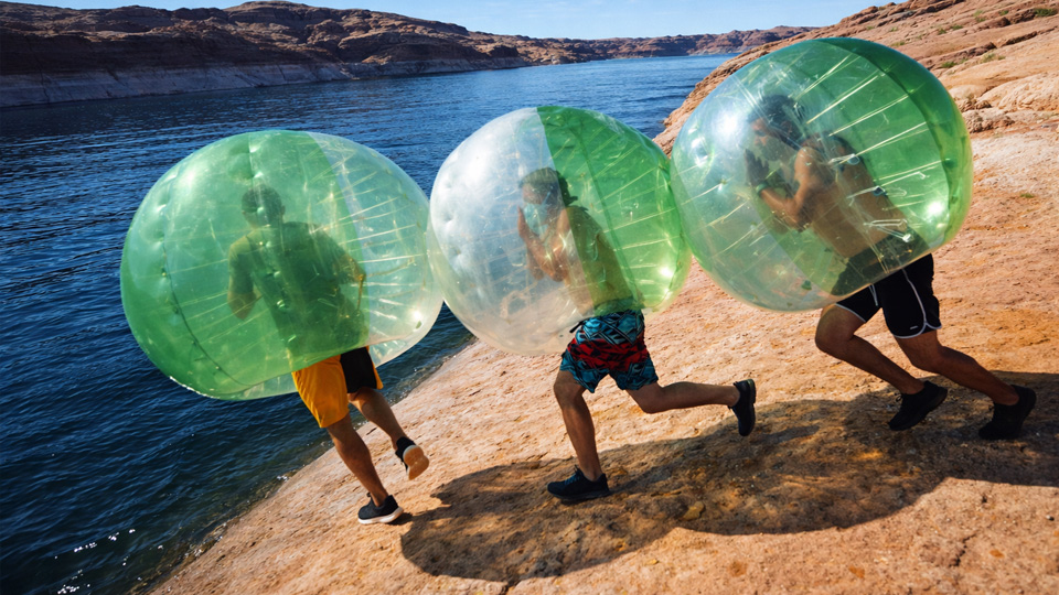 Last one standing in the zorb ball wins the island