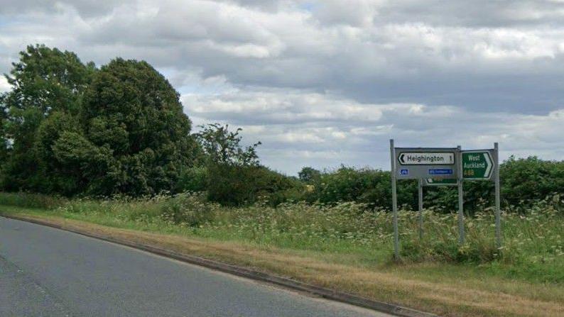 Driver dies and three injured in two-car crash