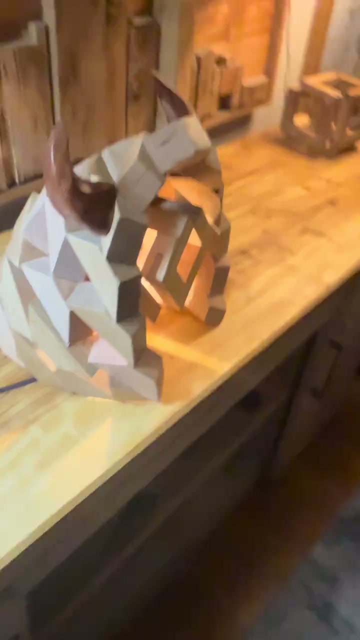 Handcrafted Viking bull lamp glows with geometric wood design