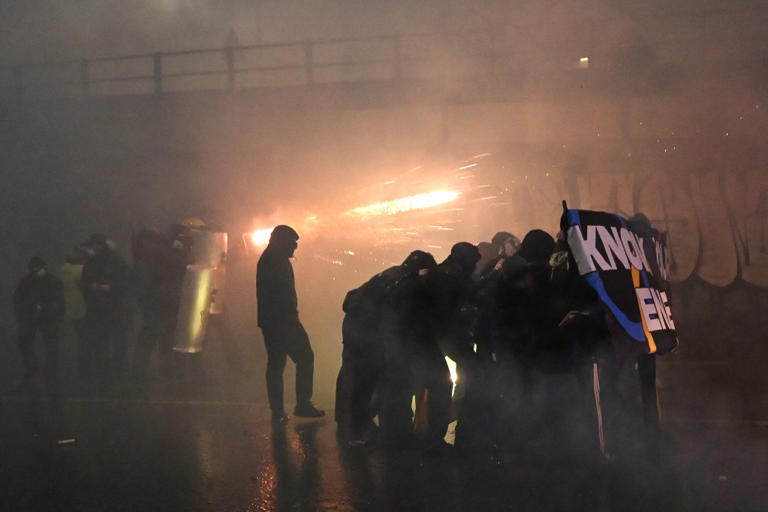 In photos: Protesters clash with police near Milan Winter Olympics site