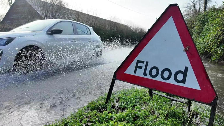 Roads closed and flood warnings after heavy rain