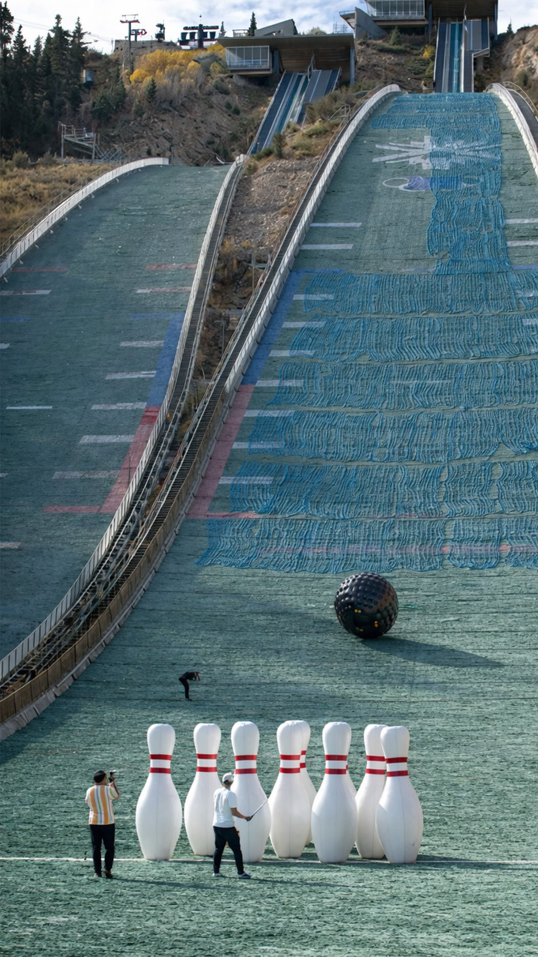 Rolling a bowling ball down a ski jump