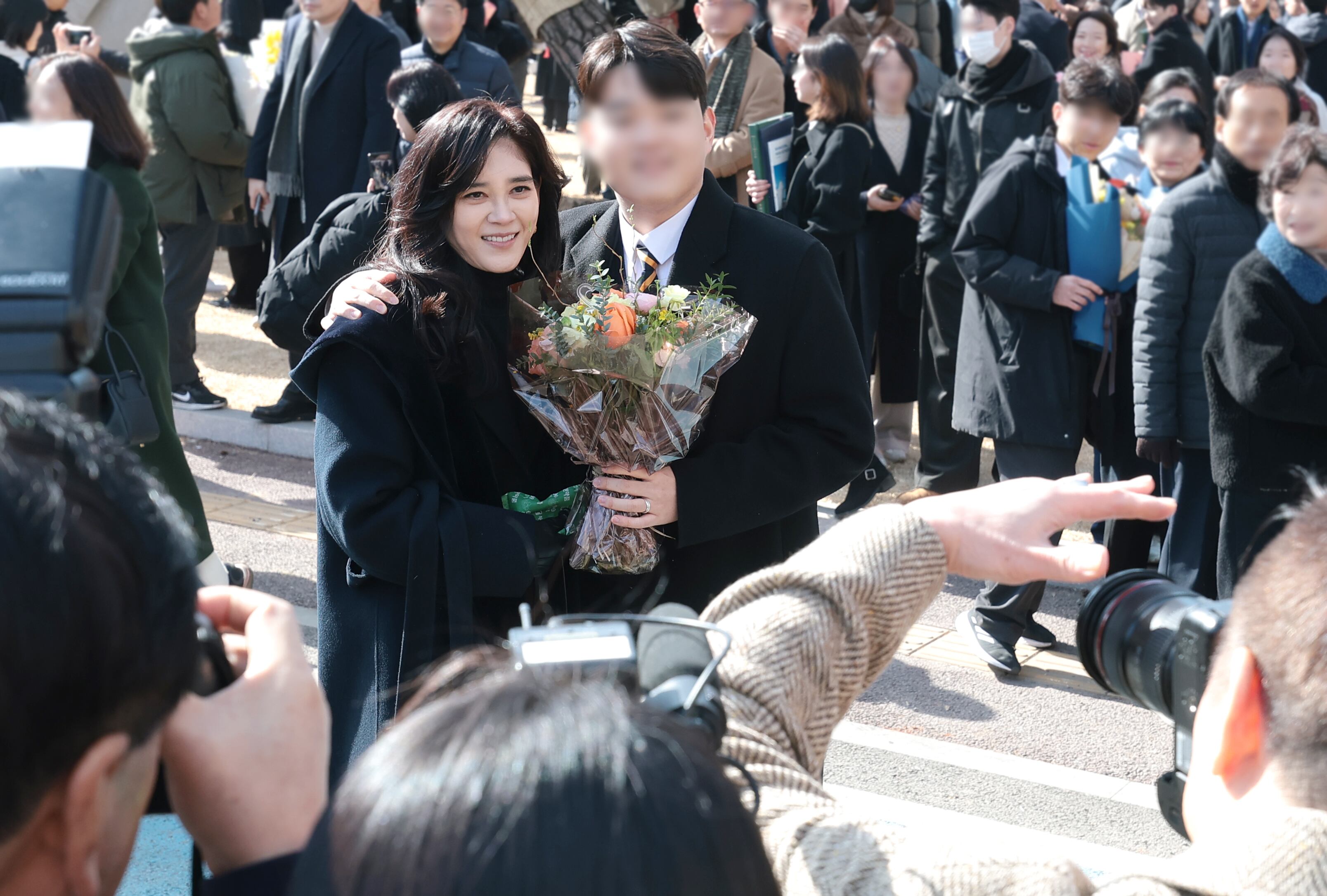 Hotel Shilla president Lee Boo-jin smiles at son's graduation