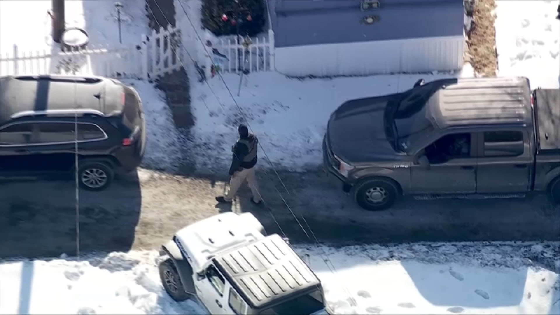 Live: Masked federal agents surround Montgomery County home