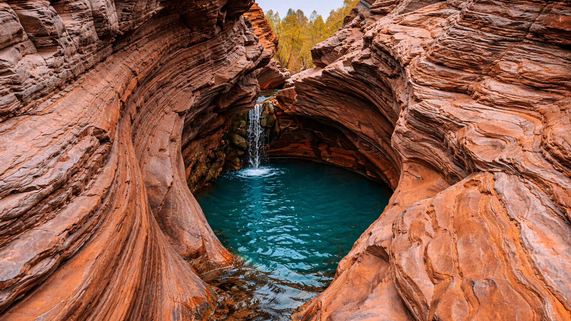 Hidden pool inside red rocks