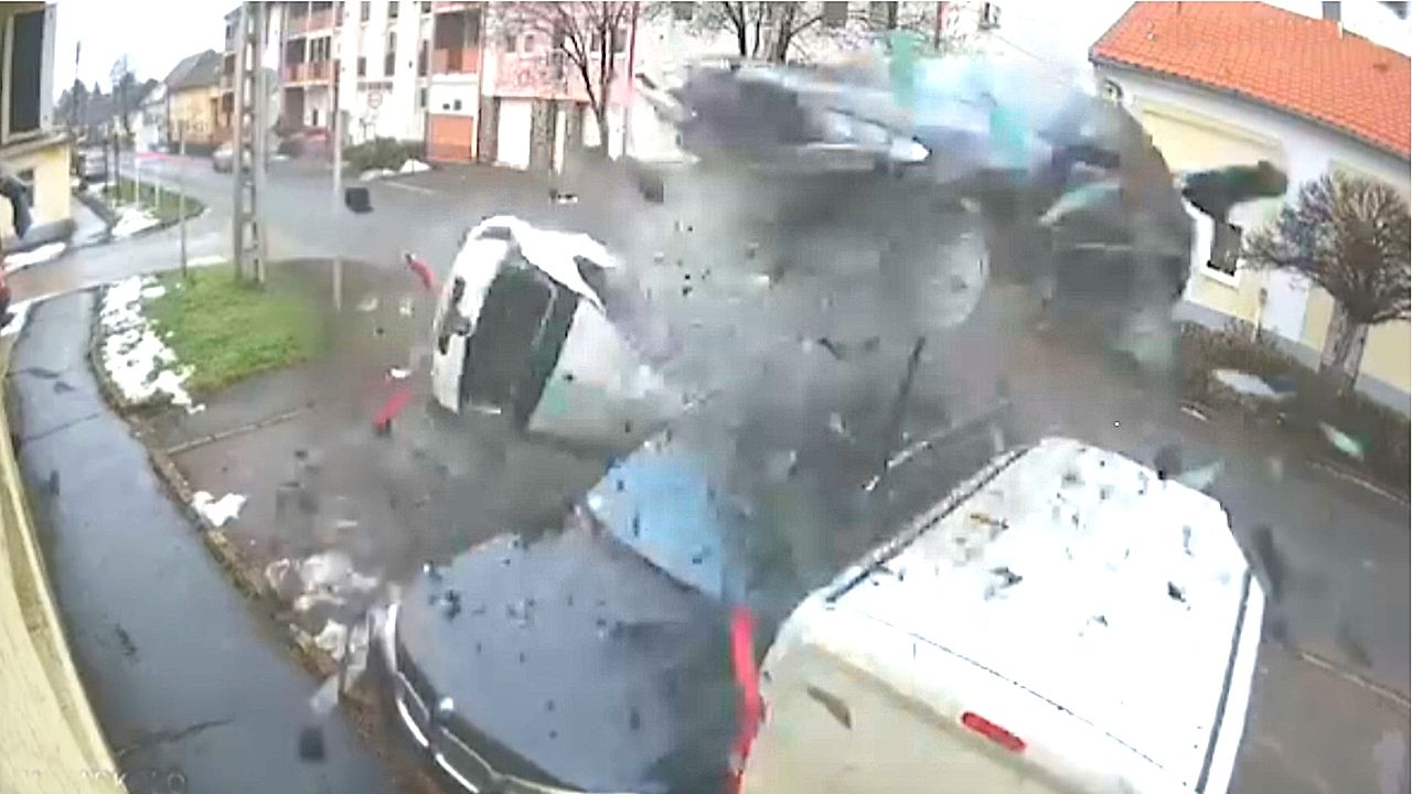 Speeding car goes airborne after slamming into parked vehicles