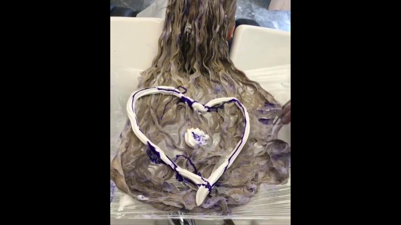 Hair coloring transformation creating a silky silver blonde look