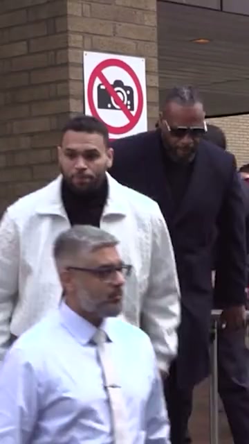 Chris Brown arrives at court over alleged tequila bottle attack
