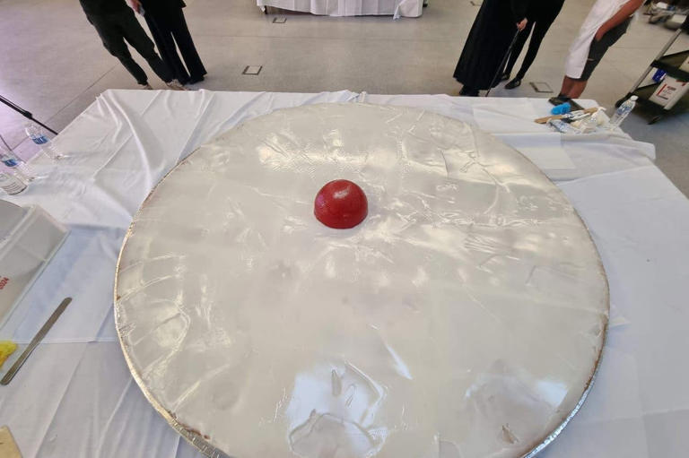 Sweet success! Bakers create largest-ever Empire biscuit to launch ...