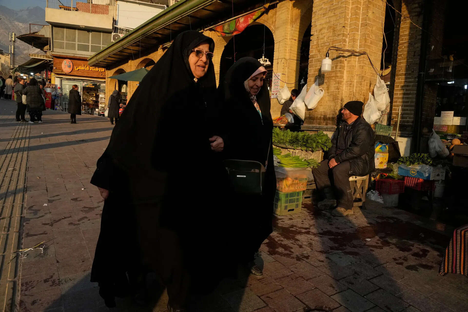 Iran's currency falls to a record low a month after protests began