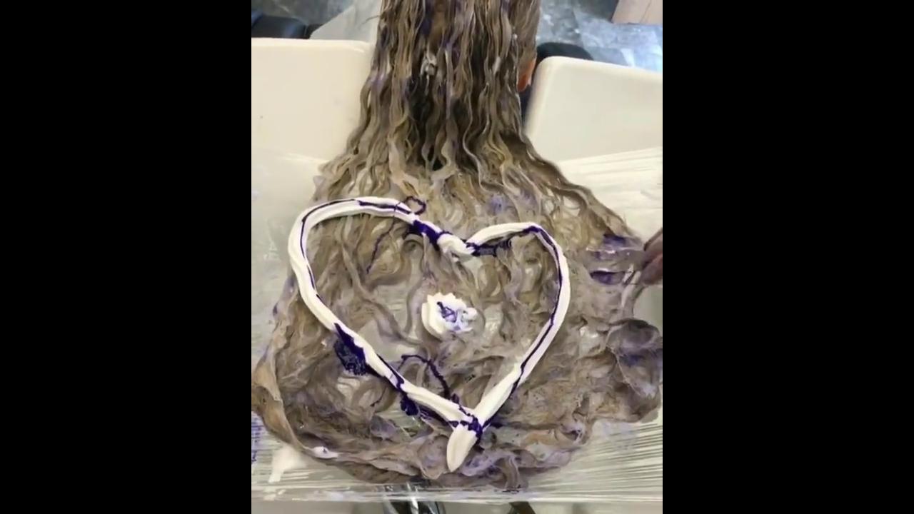 Hair coloring process resulting in long platinum blonde waves