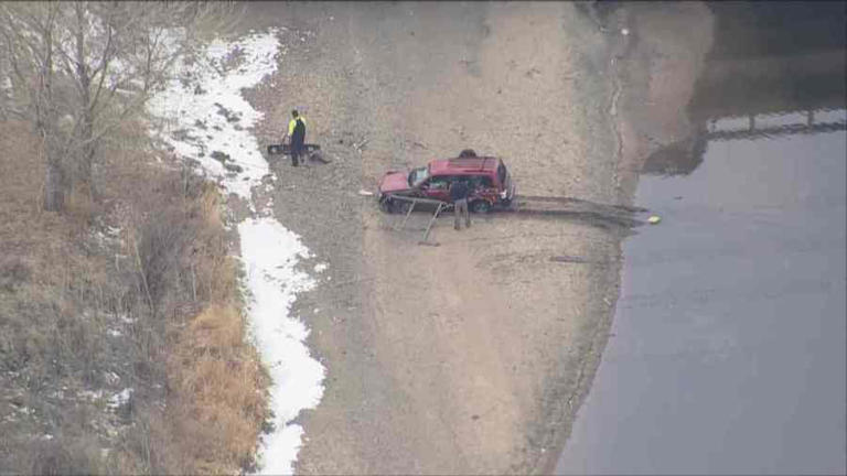 Crews respond to vehicle on frozen water in Adams County