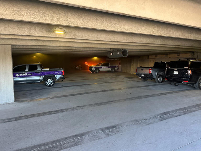Fire extinguished after car fire spreads in downtown Wilmington parking ...
