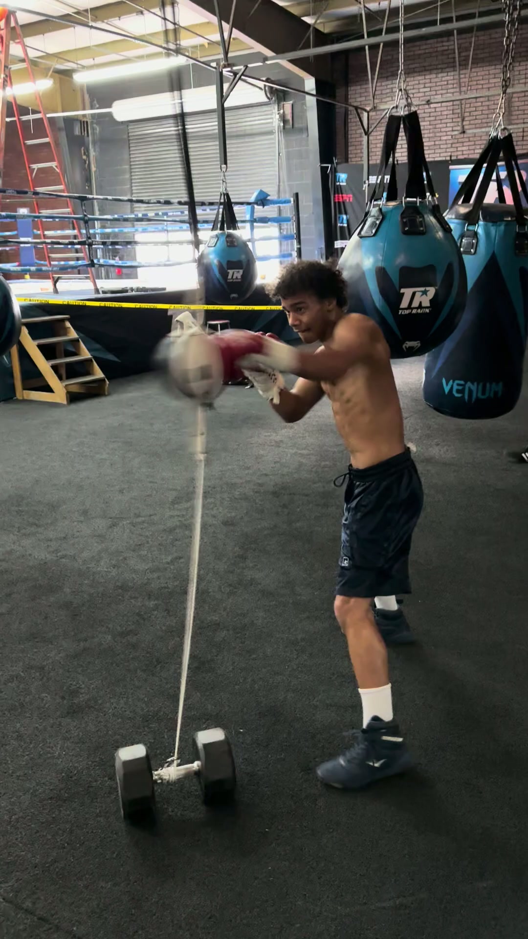 Akeem Cheatham sharpening the tools, working a turning drill on the ...