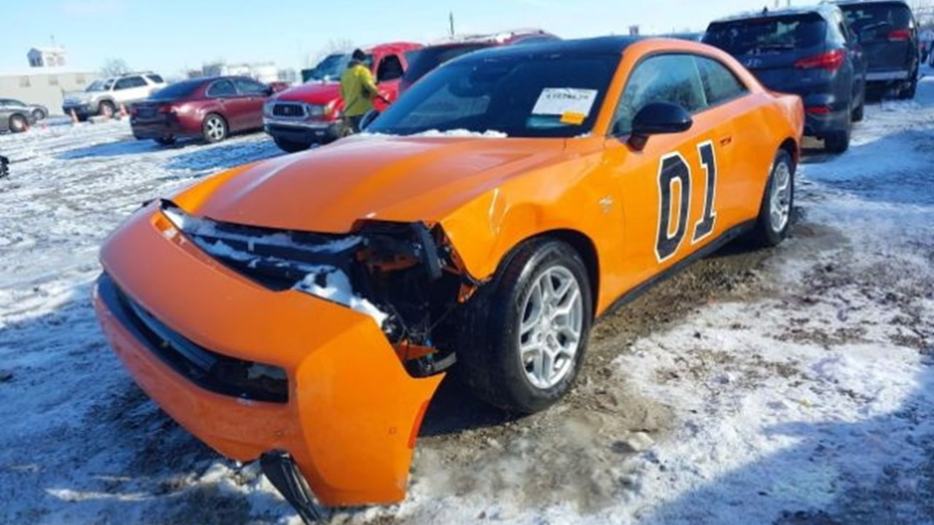 Crashed 2025 Dodge Charger Daytona General Lee sitting in junkyard