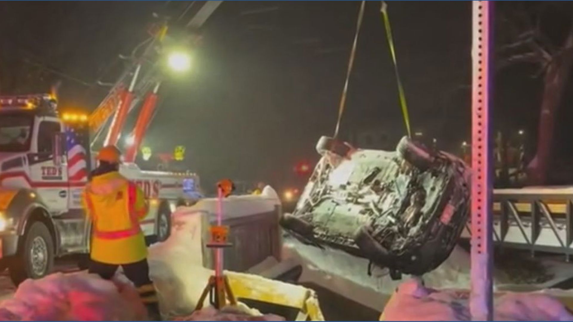 Nurse rescued after car slides off icy bridge into river in ...