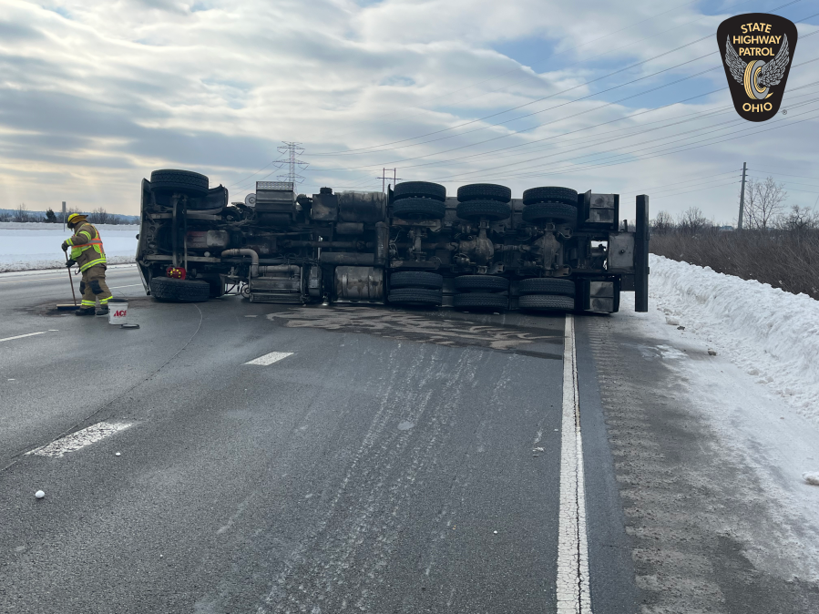 I-75 crash: GMC spins out, Peterbilt truck flips over