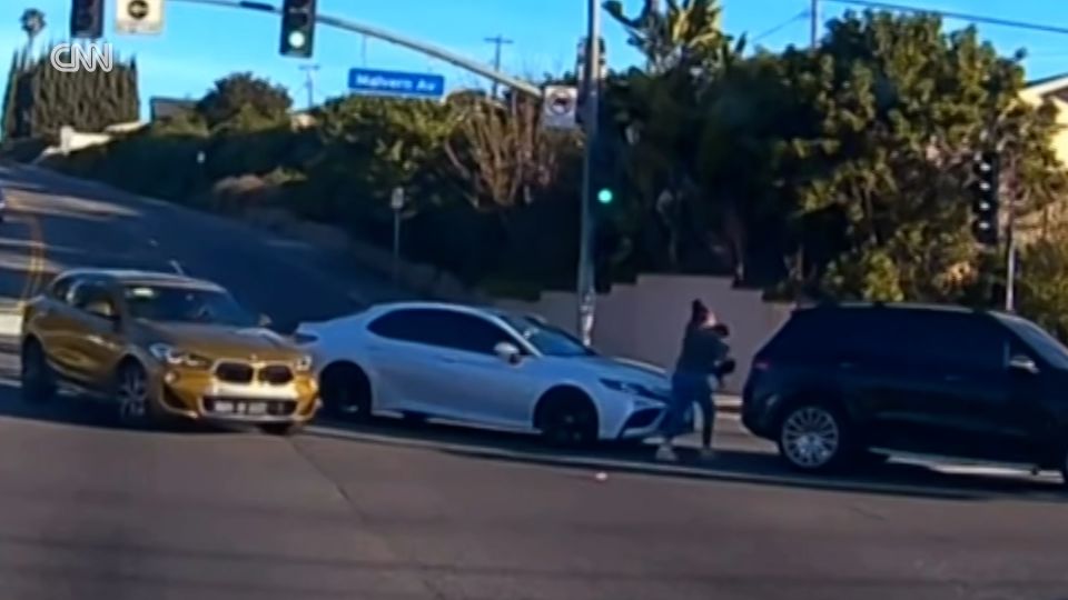 Video shows the harrowing moment a toddler falls out of a moving car