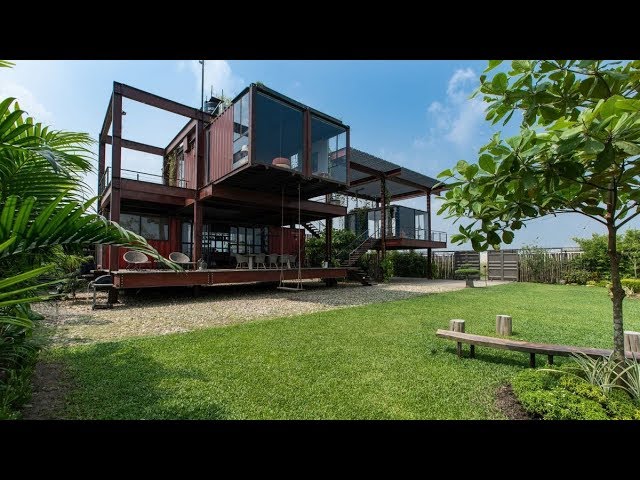 A shipping container house with a surprisingly lightweight appearance