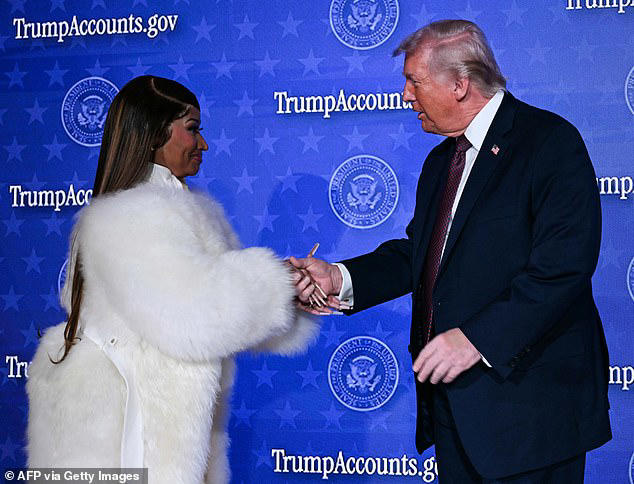 Nicki Minaj flashes dagger-long nails as she clutches Trump's hand ...