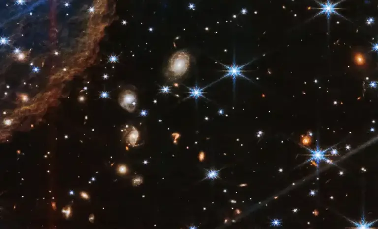 NASA’s Webb telescope spots a giant ‘cosmic question mark’ in the heart ...