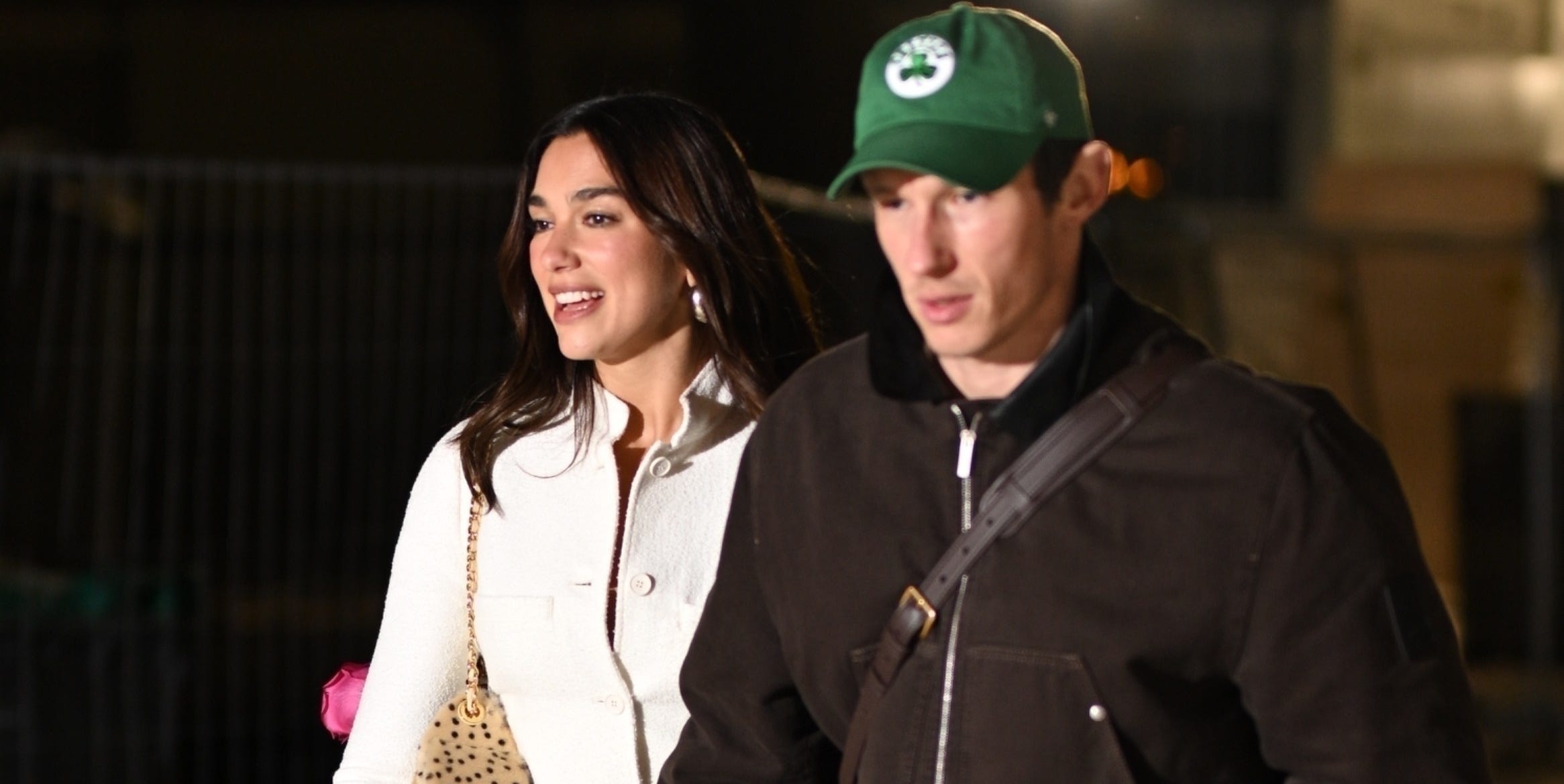 Dua Lipa zhuzhes up her Paris date-night fit with a furry statement bag