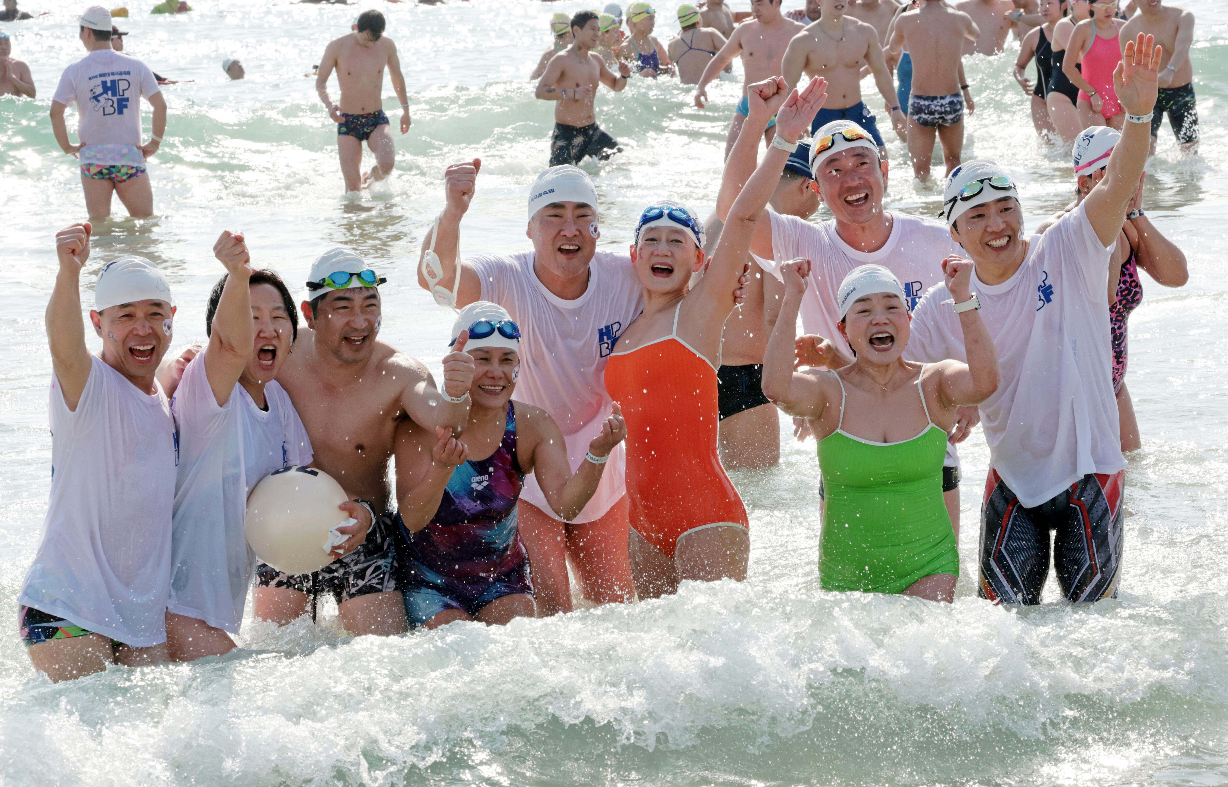 Busan's polar bear swimmers brave winter sea in renewal ritual