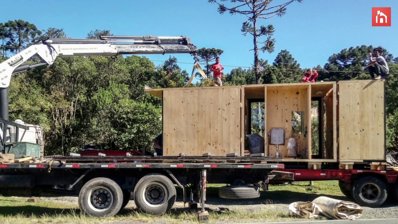 A beautiful prefab cabin inserted in a small forest clearing in ...