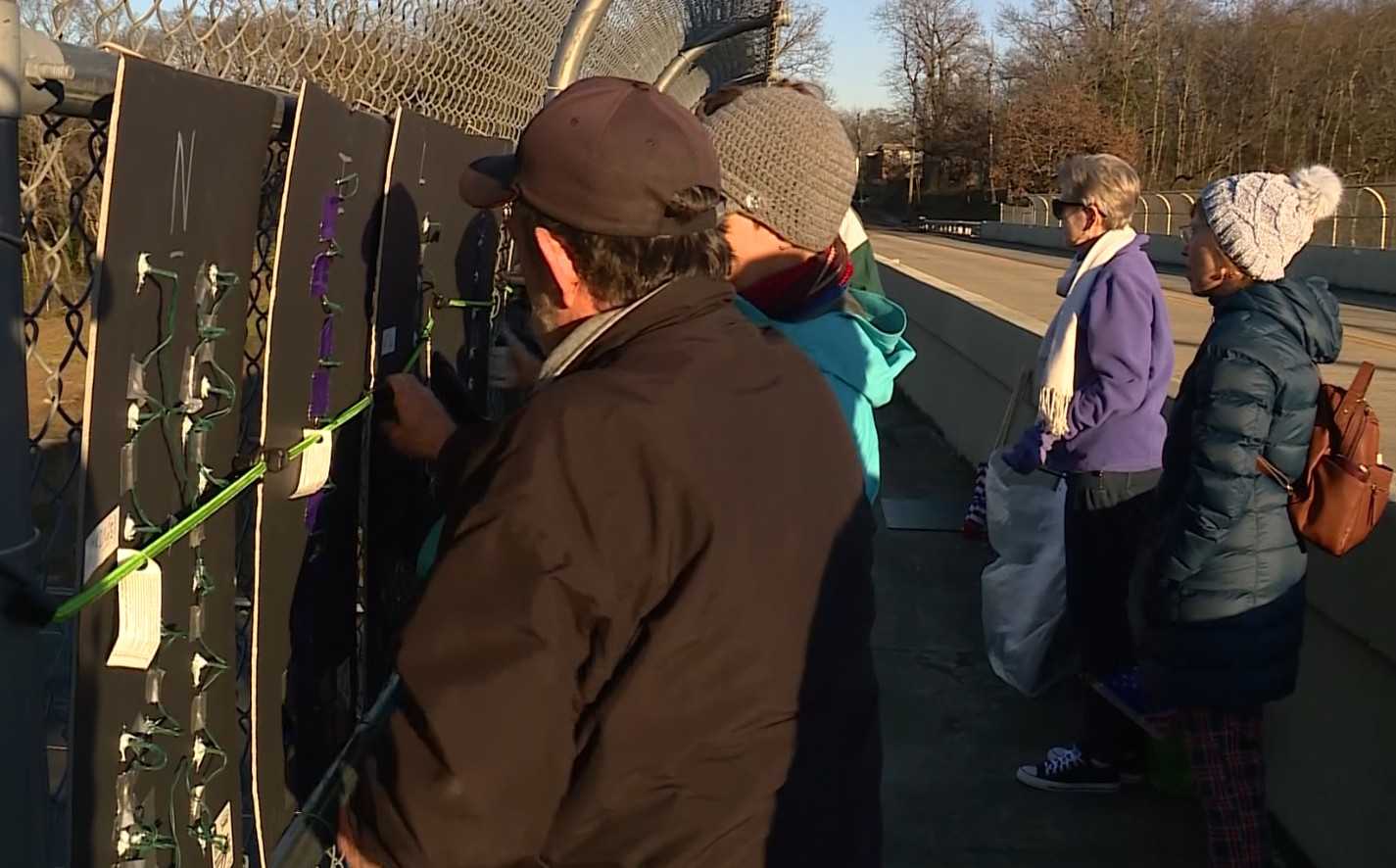 Birmingham group protests ICE actions with highway sign