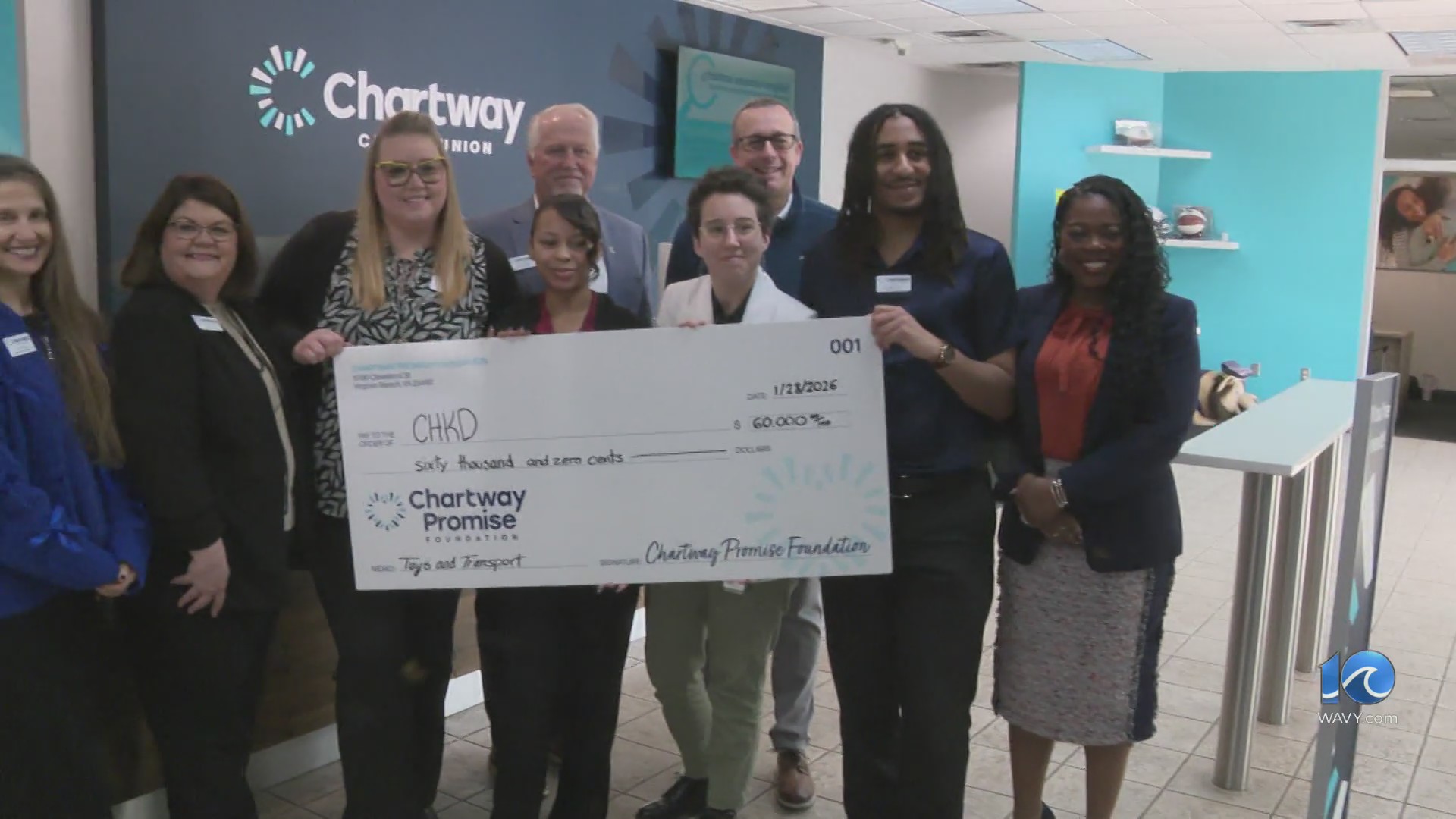 Chartway employees, volunteers stuff toy bags for kids at CHKD