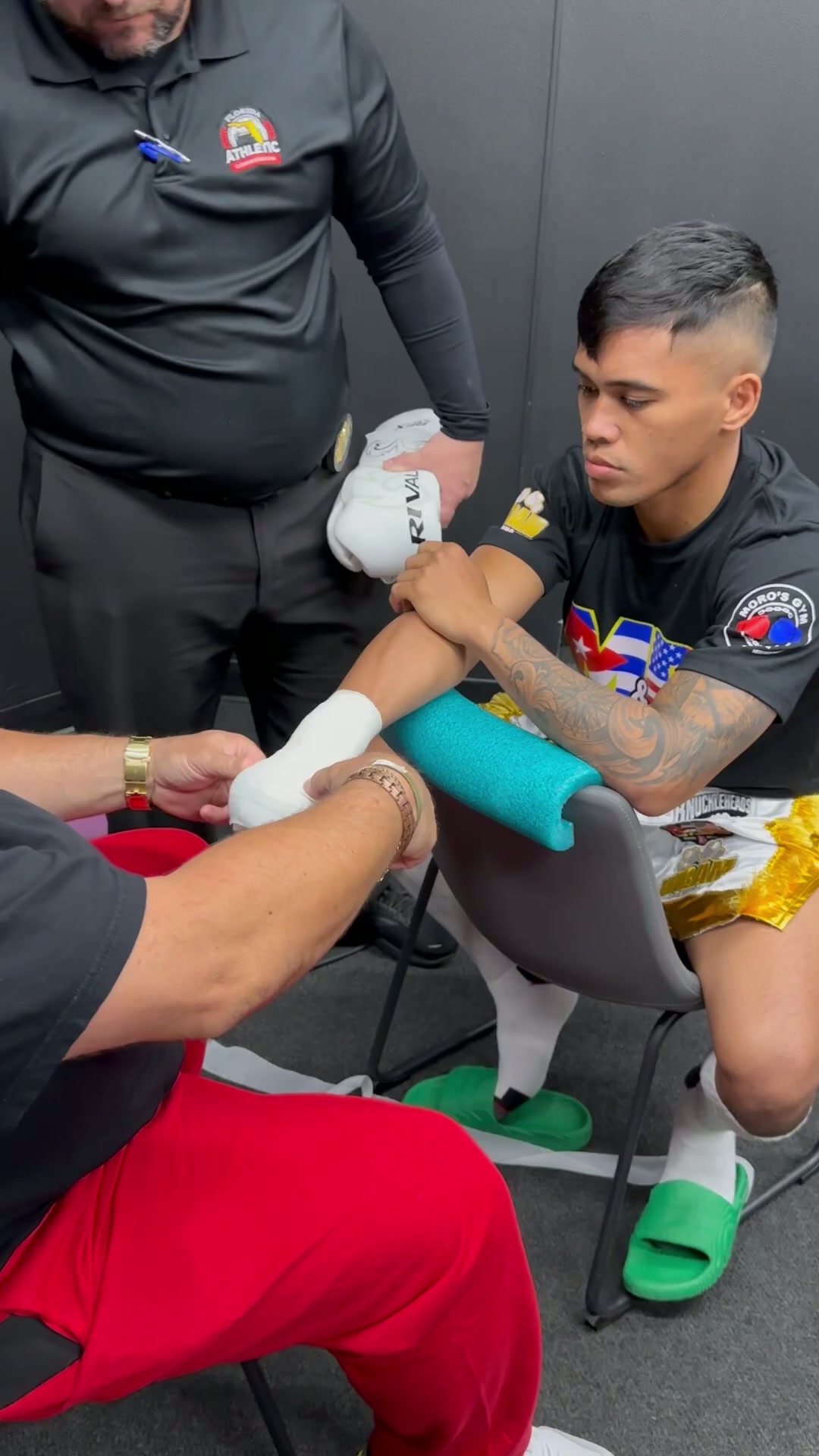 Mike Plania getting his hands wrapped for his fight