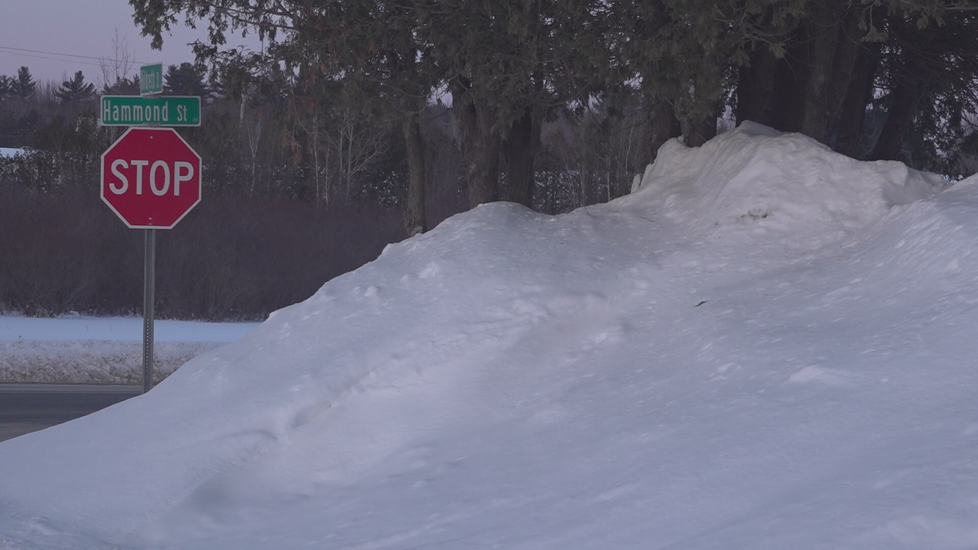 Tall snow banks can be a safety hazard for drivers, officials warn