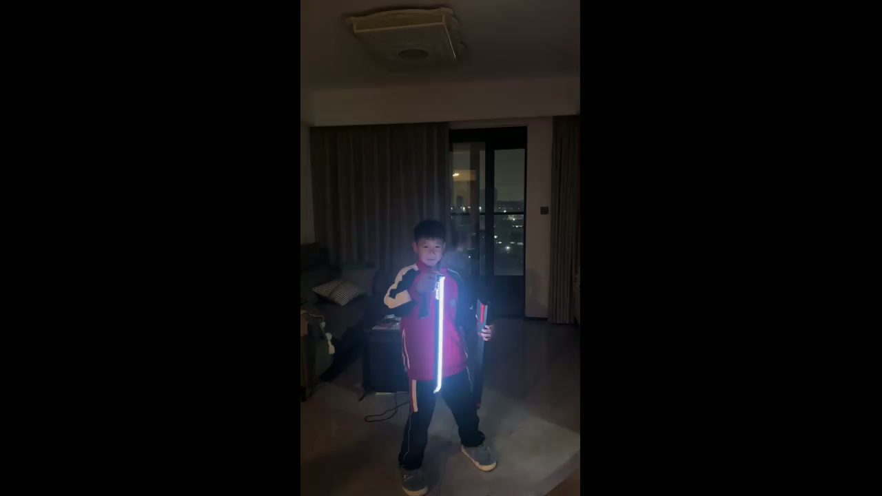 Boy’s electric sword sparks and breaks during playful demonstration in ...
