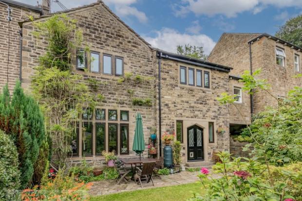 Charming Delph cottage with fruit-filled garden hits the market at £585k