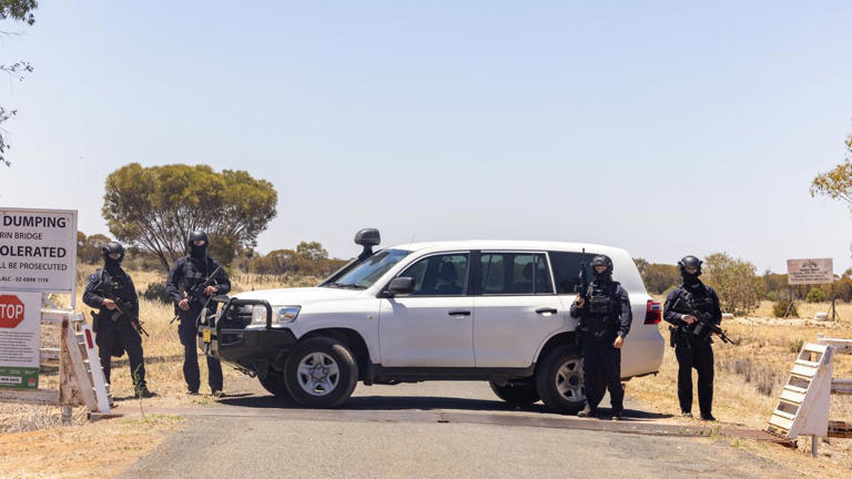 Alleged triple killer spotted at police station