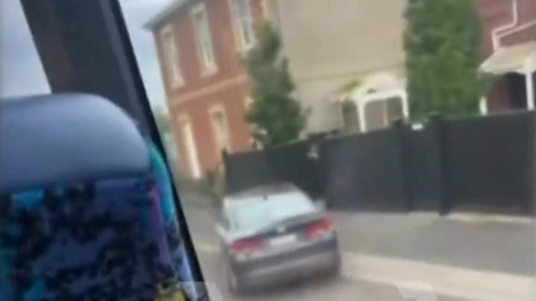 Gunfire erupts after car hits school bus