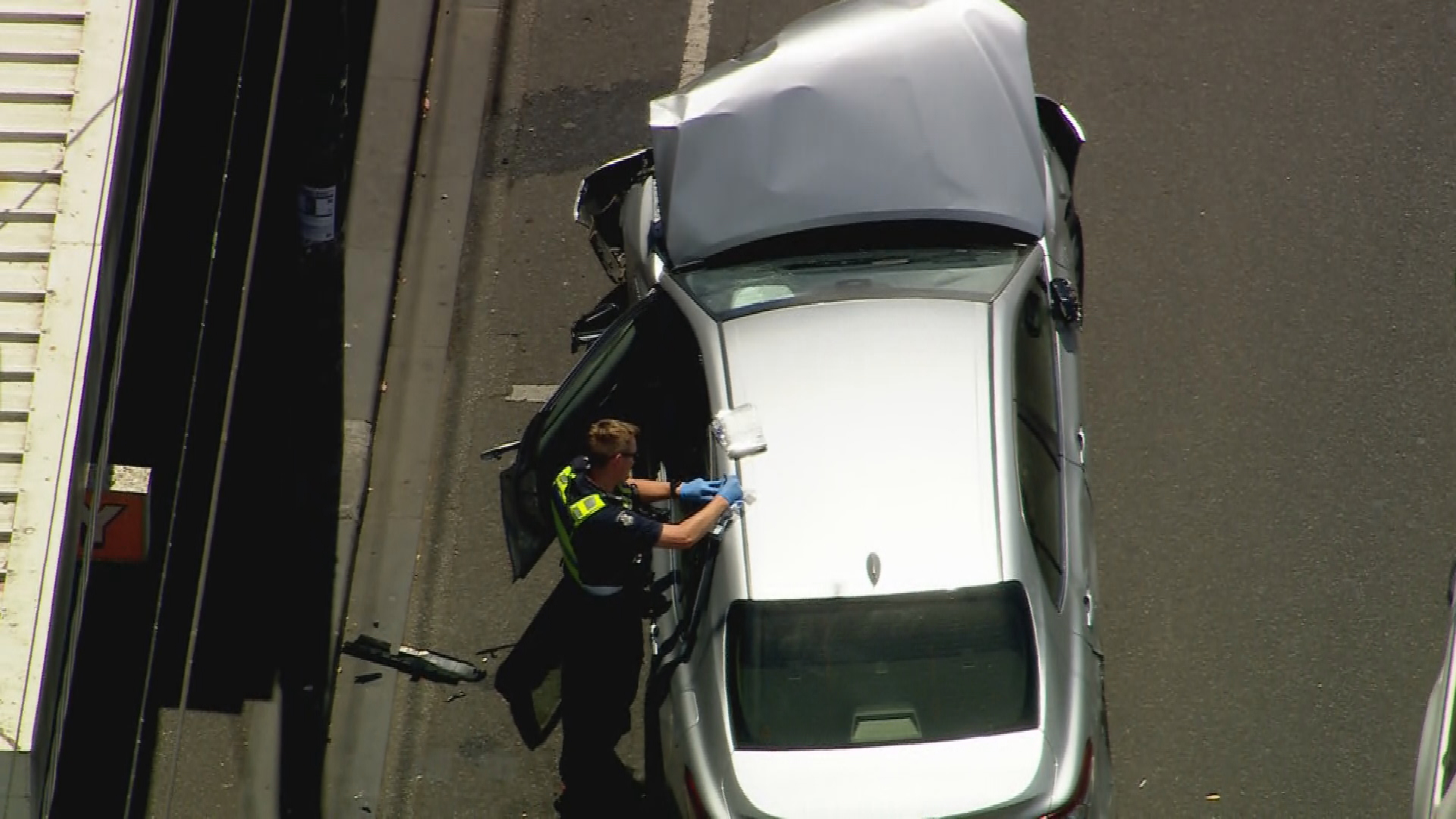 Man restrained by passersby after car crashes into multiple others on ...