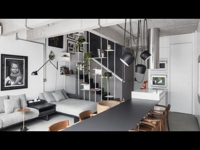 Modern apartment with a green wall and a minimalist interior