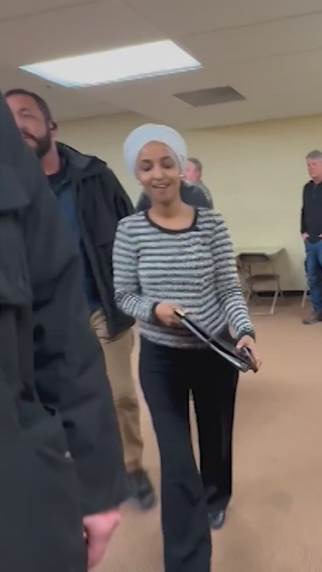 Rep. Ilhan Omar (D-MN) responds to beinr sprayed at a town hall meeting