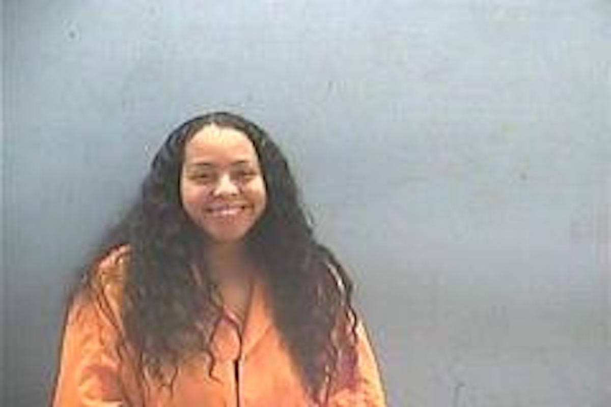 Woman smiles in mugshot after beating pregnant mother of 2 with ...