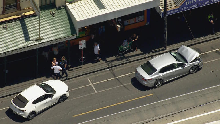 Man restrained by passersby after car crashes into multiple others on ...