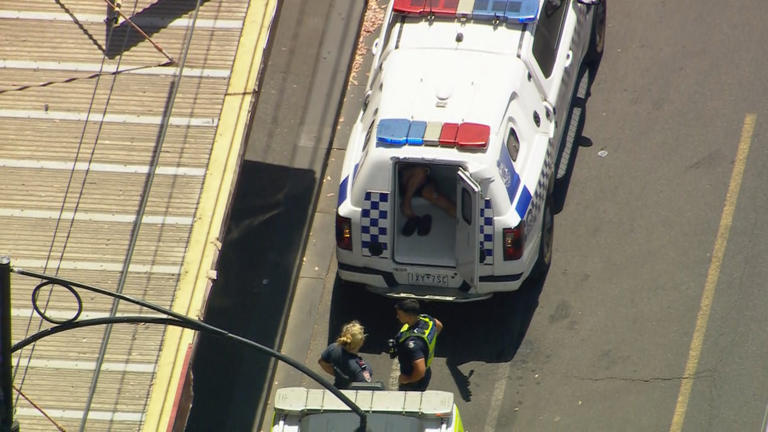 Man restrained by passersby after car crashes into multiple others on ...