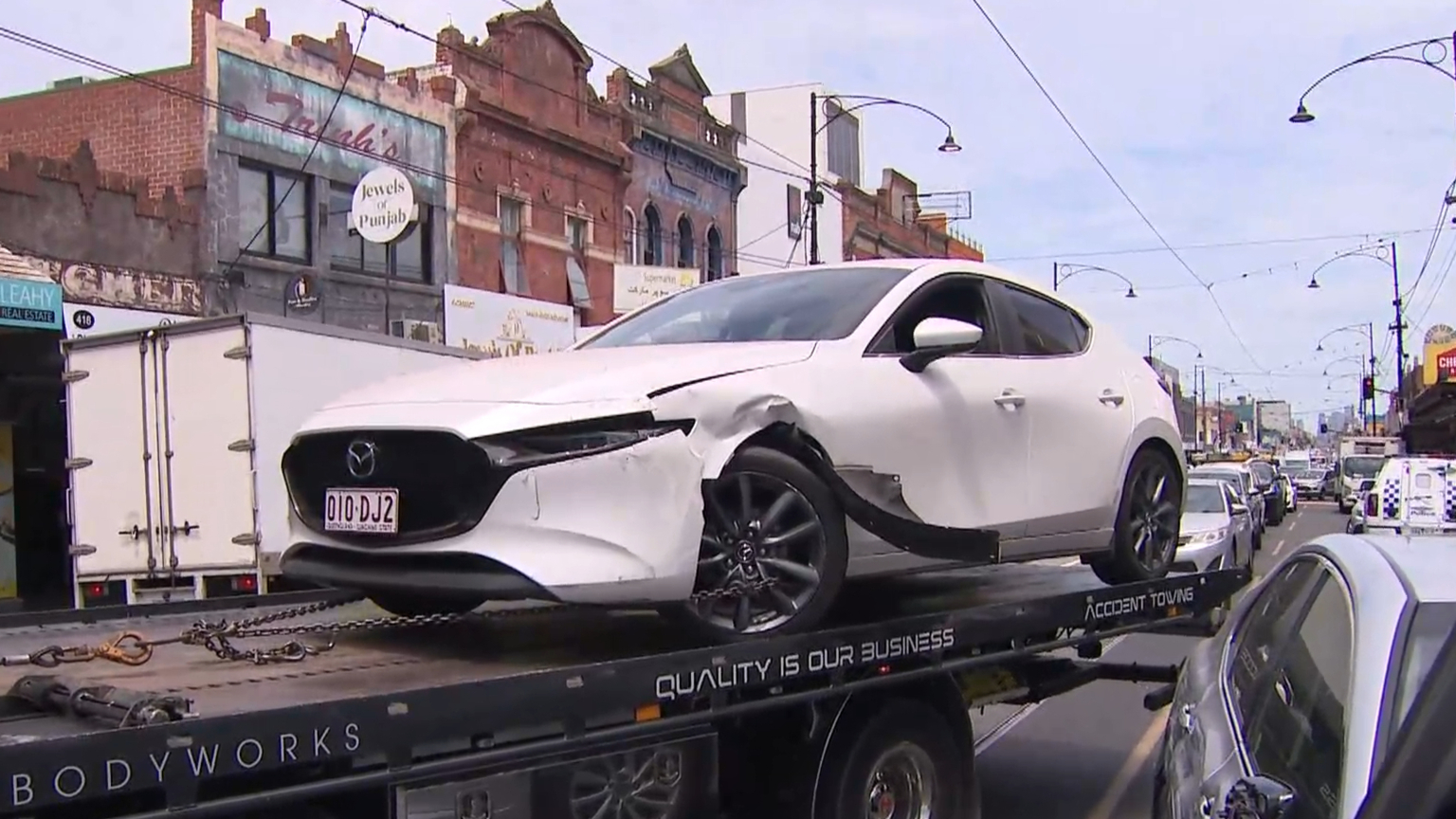 Man restrained by passersby after car crashes into multiple others on ...