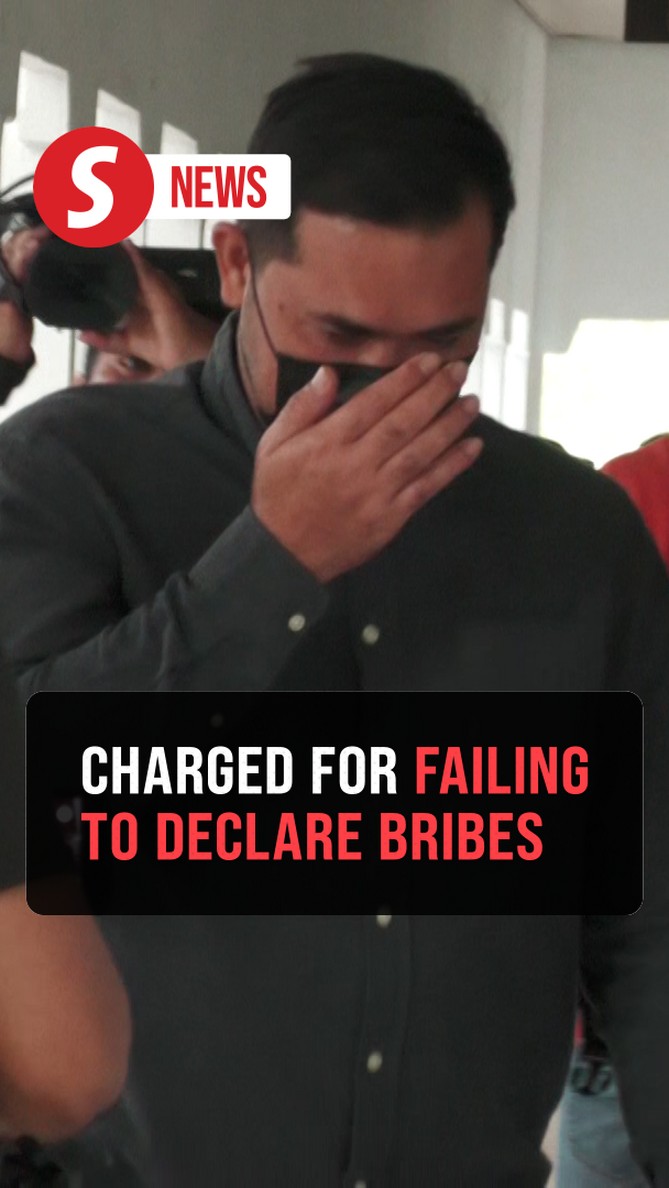 Immigration officer faces seven charges over bribe non-disclosure