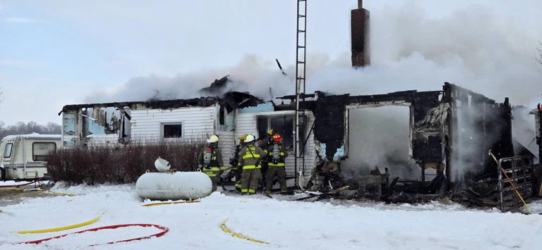 Firefighters battle extreme cold while extinguishing mobile home fire