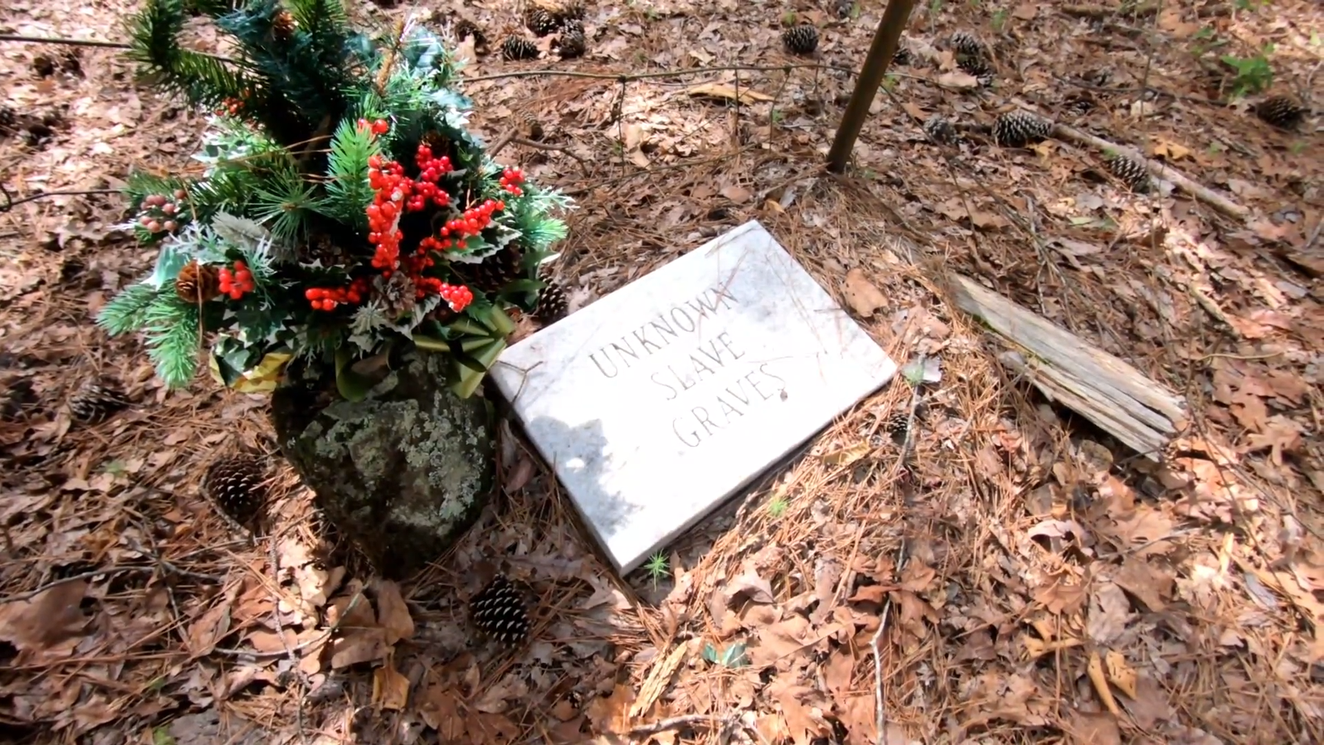 We found an 'unknown slave' grave marked only by stones