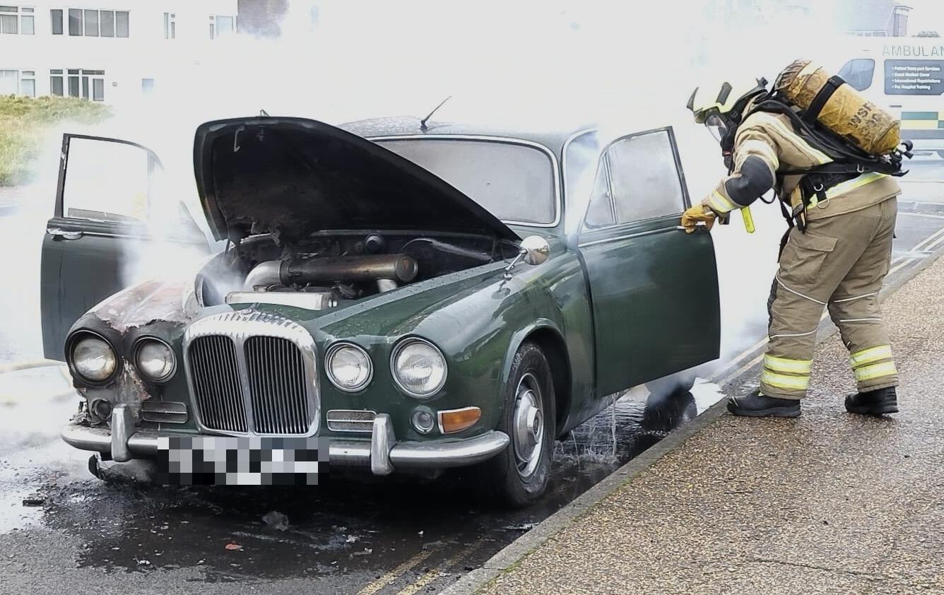 Police officers join emergency response to car fire in West Sussex village